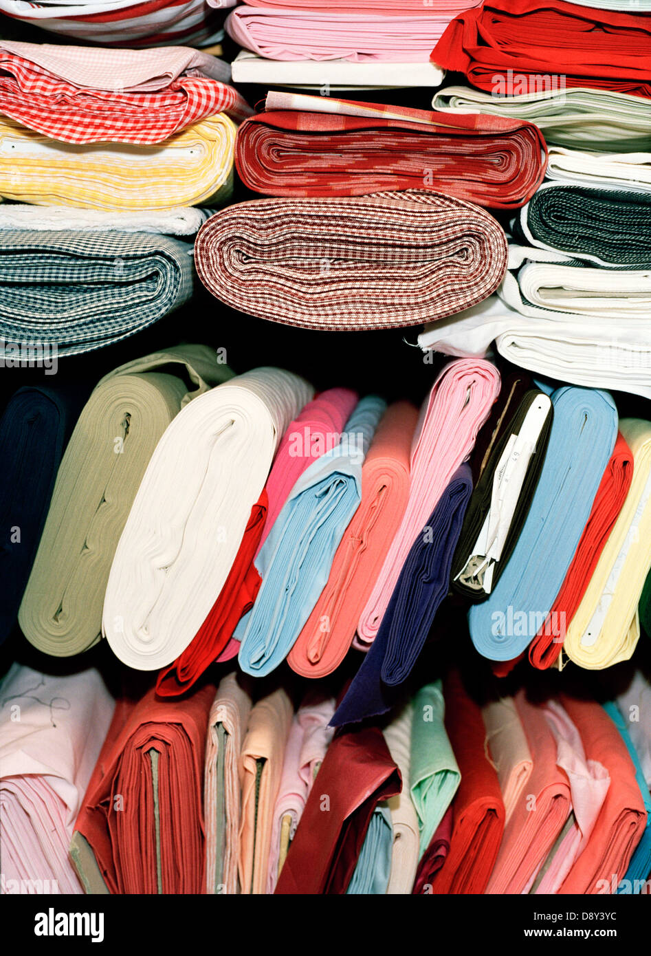 Folded multicolored cloth pieces in rows, close-up Stock Photo - Alamy