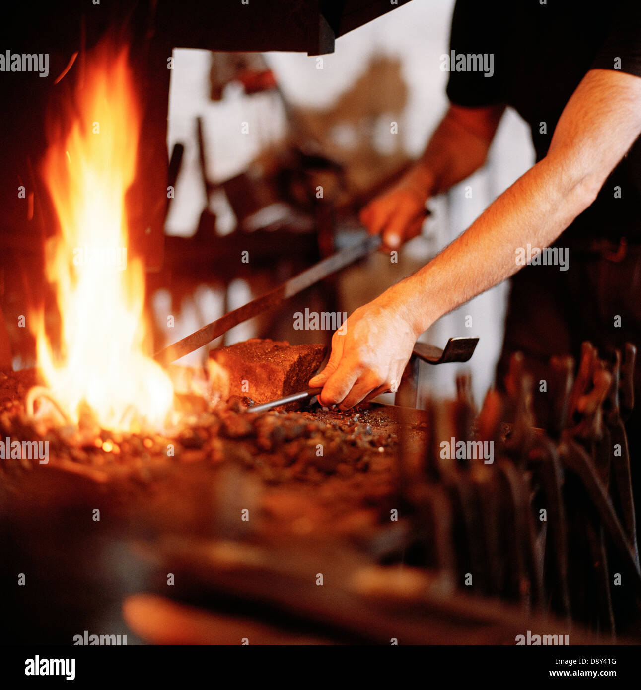 A smith hammering Stock Photo - Alamy