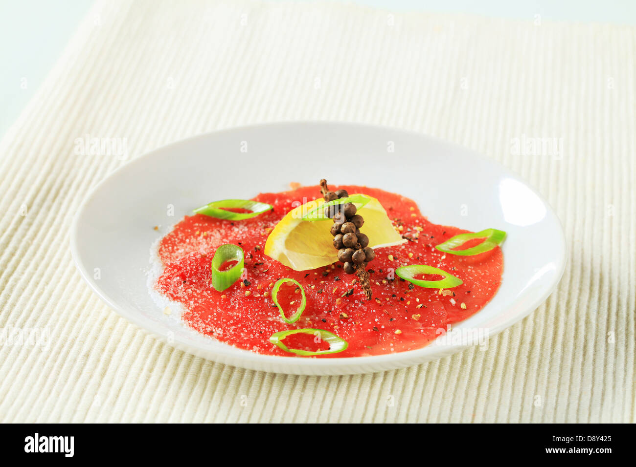Beef Carpaccio with lemon and spring onion Stock Photo - Alamy