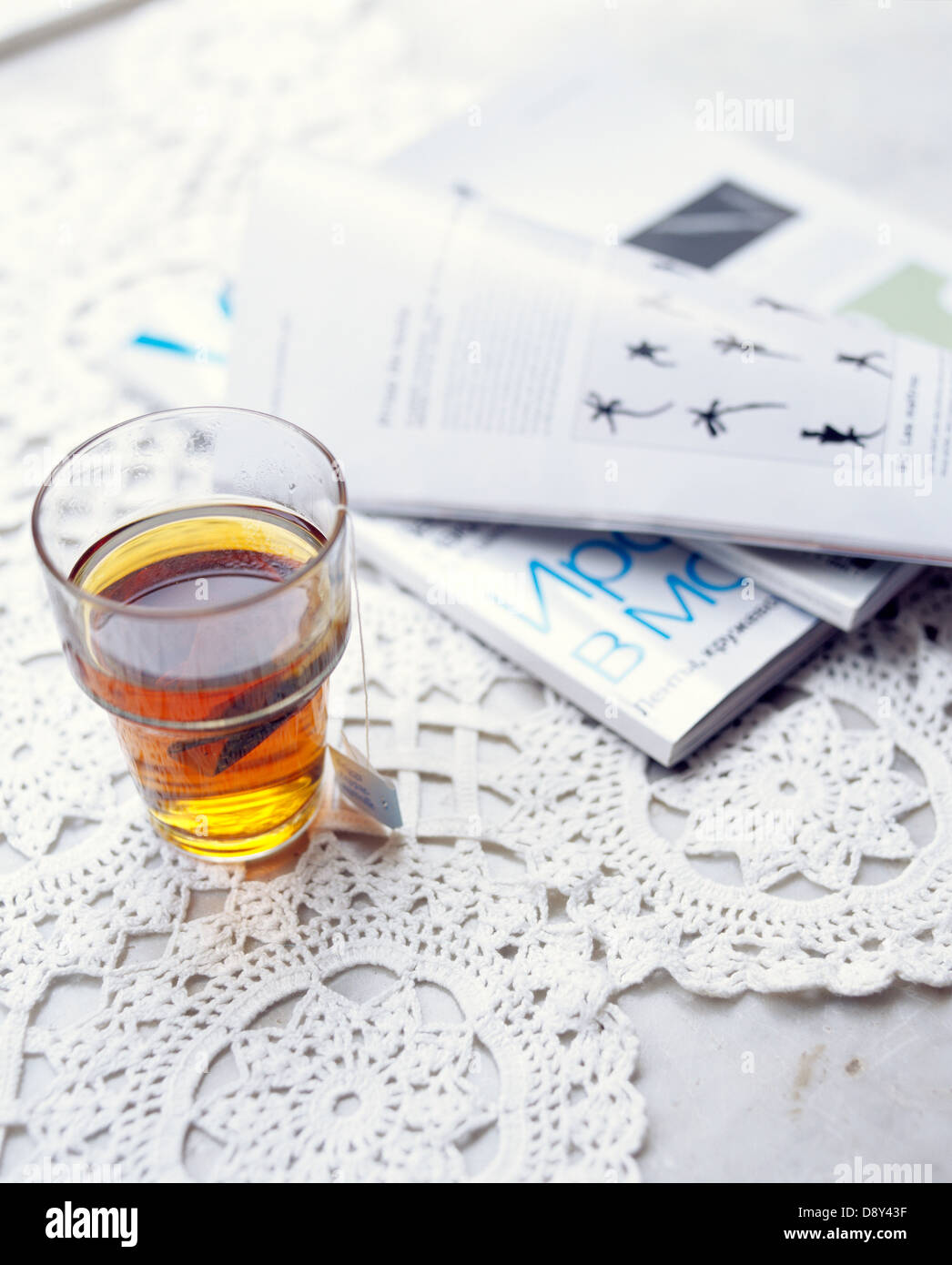 Tea and weekly magazine Stock Photo - Alamy