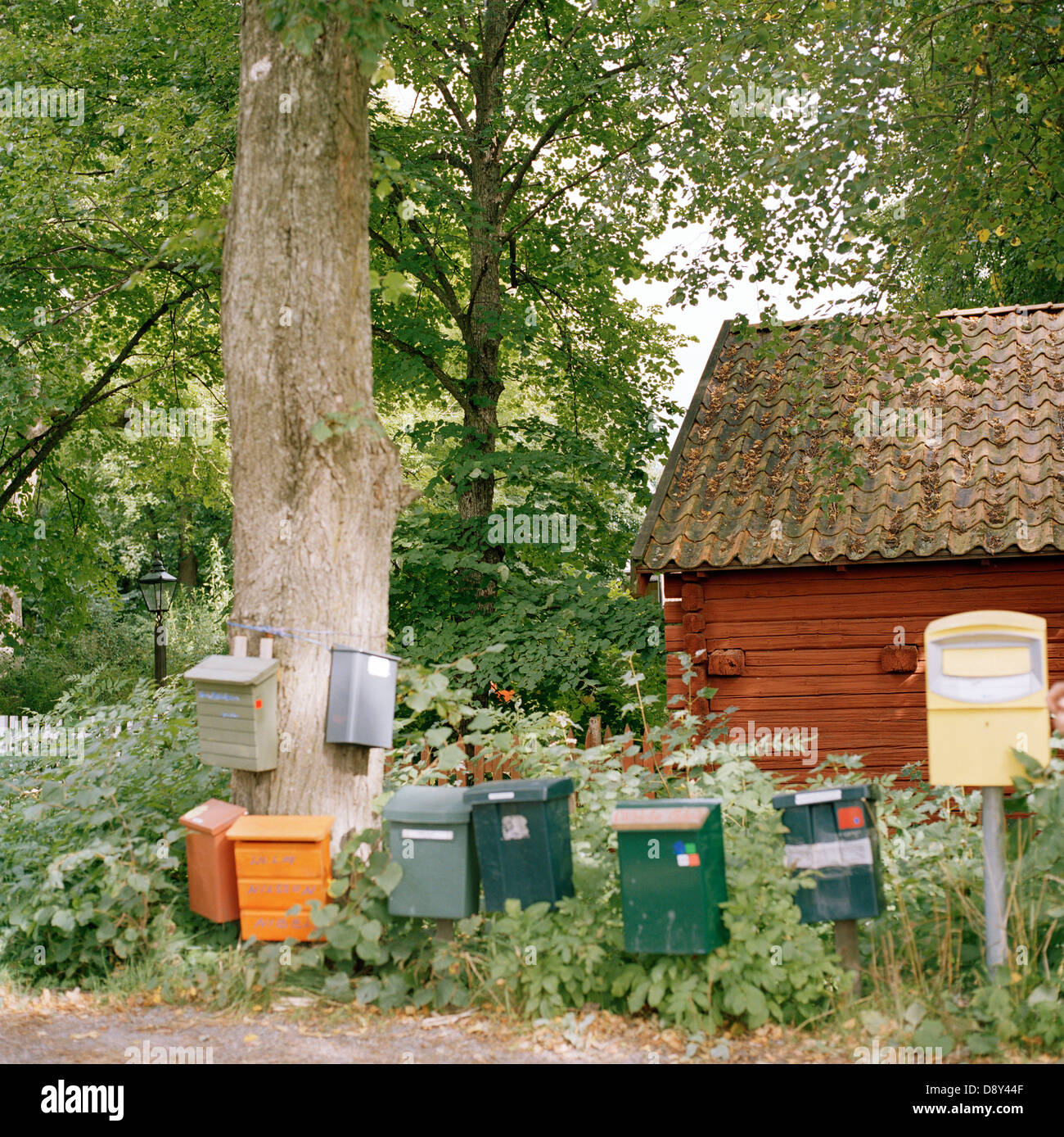 Mail box and letterbox in front of a log house Stock Photo - Alamy
