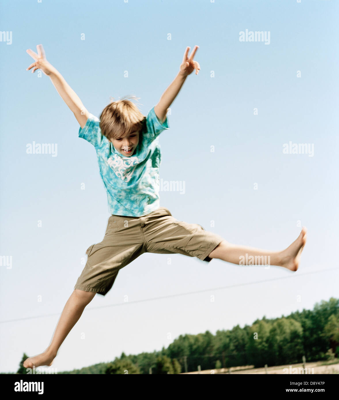 A boy jumping high Stock Photo - Alamy