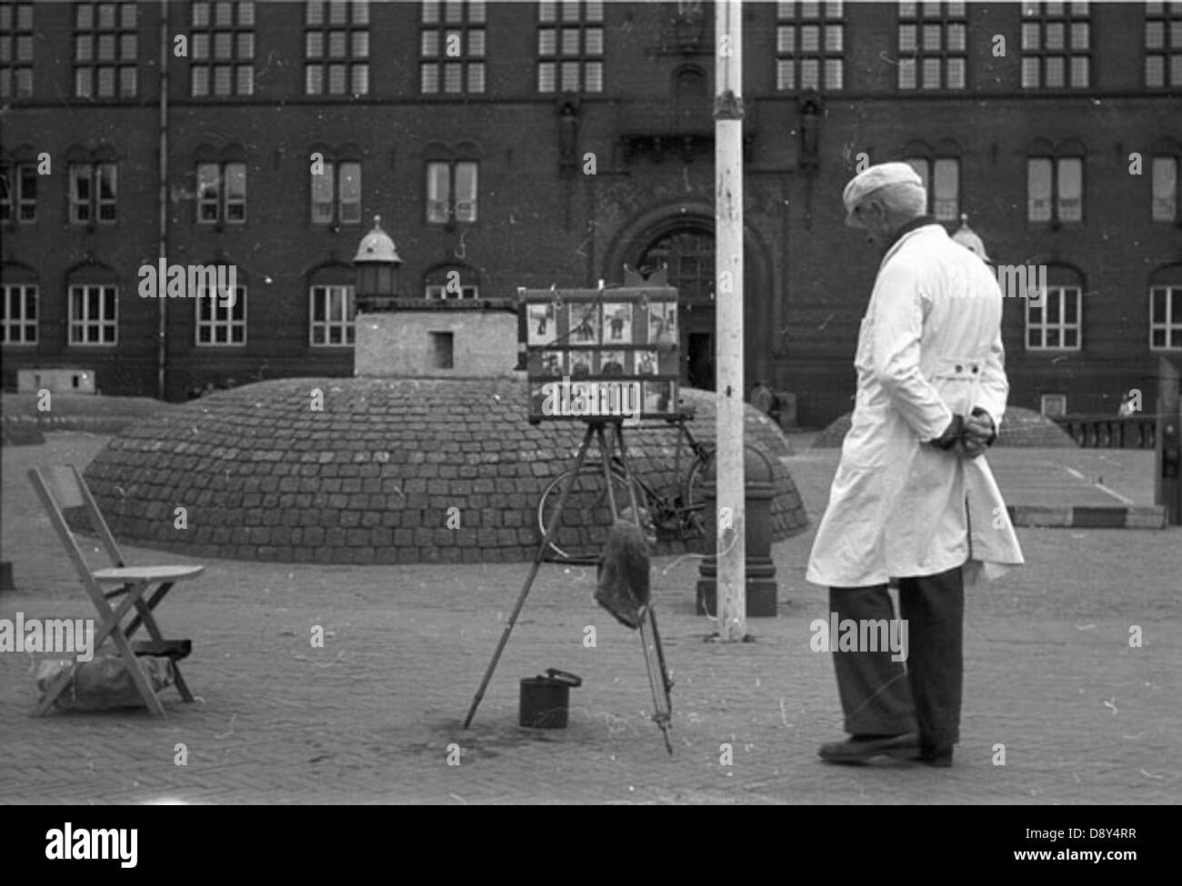 A 1946 photograph of a photographer in Copenhagen, showcasing the early ...
