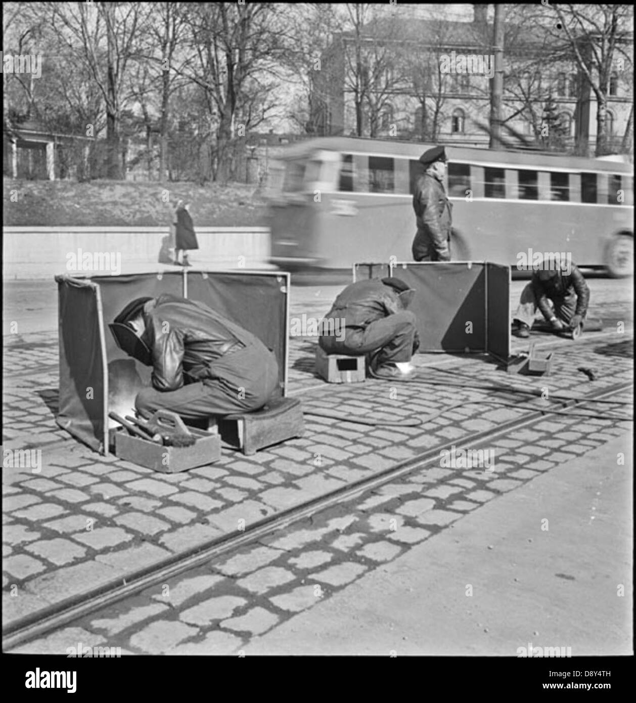 This photograph from 1948 shows workers welding railroad tracks during ...