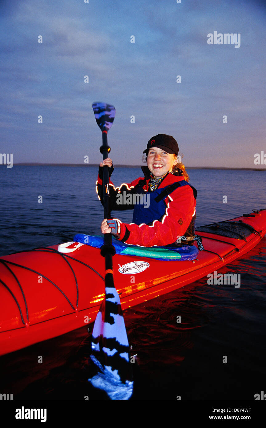 A smiling woman in a kayak Stock Photo - Alamy