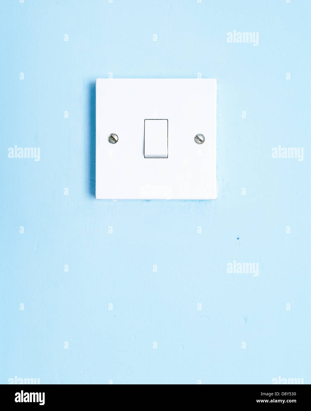 A white light-switch on a blue wall Stock Photo - Alamy
