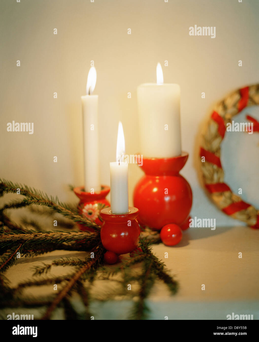 Burning candles in candlesticks Stock Photo - Alamy