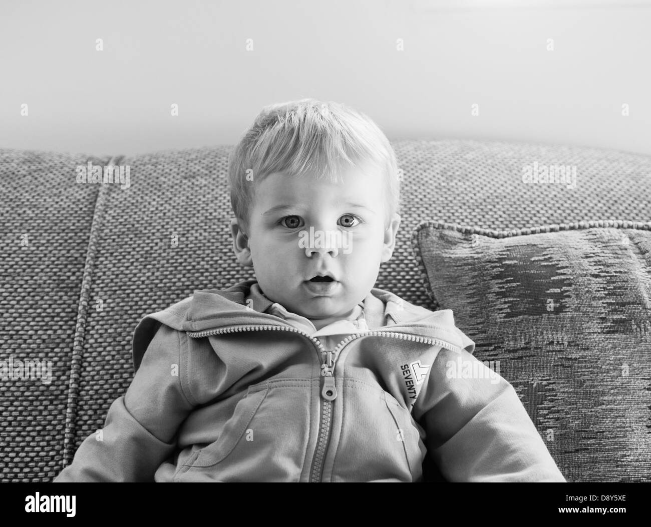 A young boy stares at the camera Stock Photo - Alamy