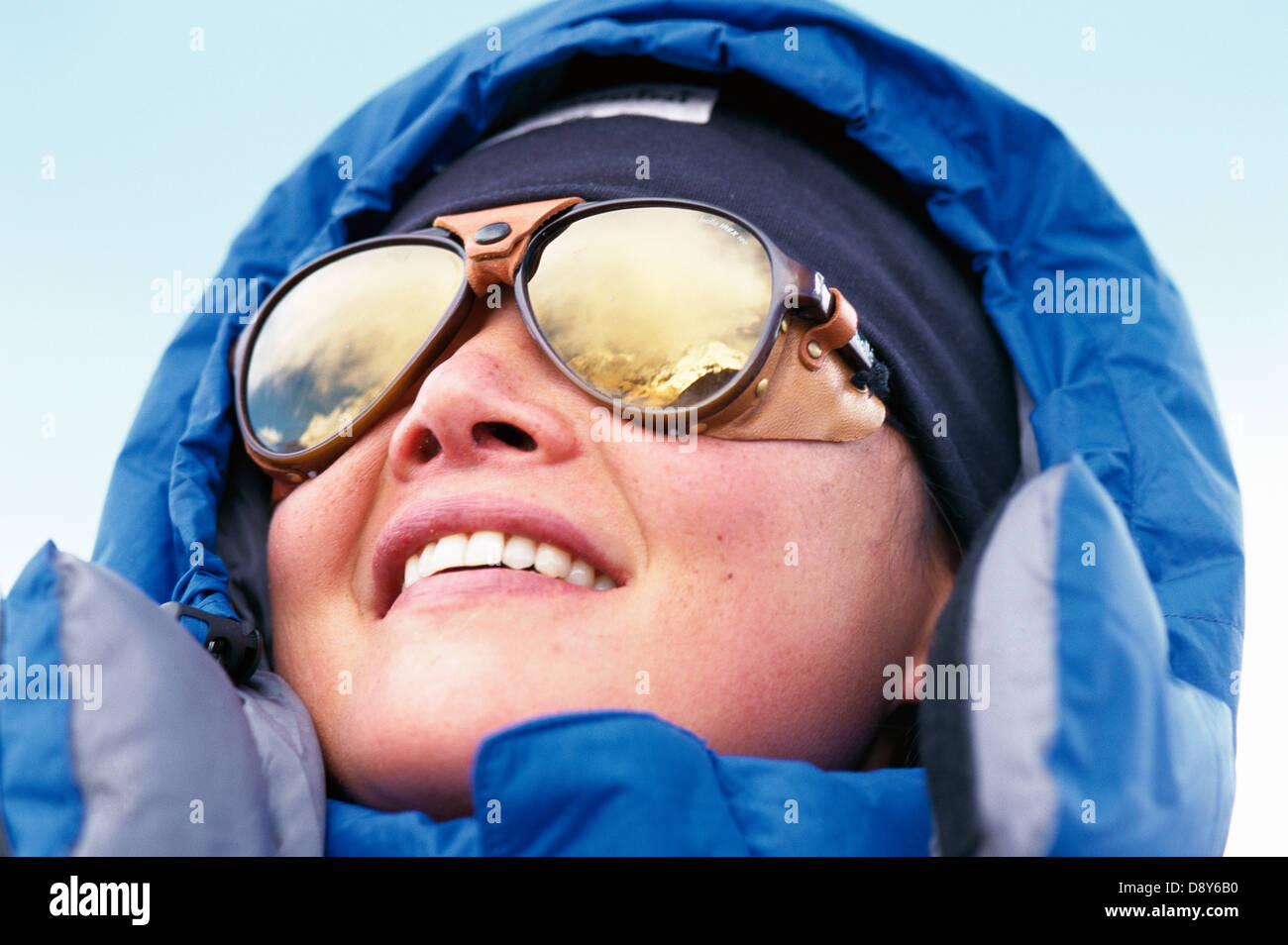 A woman with reflecting sun glasses Stock Photo - Alamy