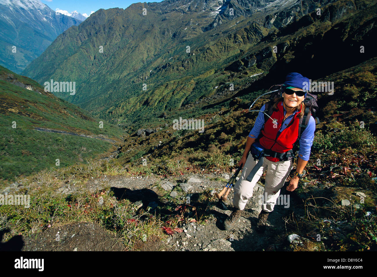 A woman hiking in the Himalayan mountains Stock Photo - Alamy