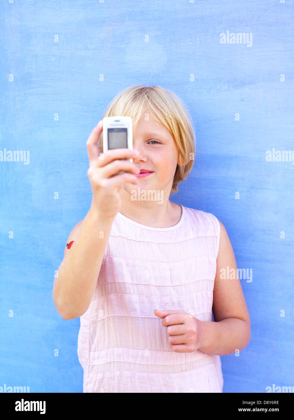 Girl taking a photograph of herself with mobile telephone Stock Photo ...