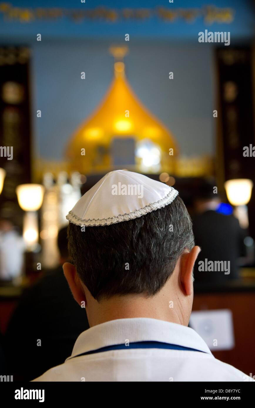 A man wearing a kipa stands in the new synagogue at the Bukharian ...