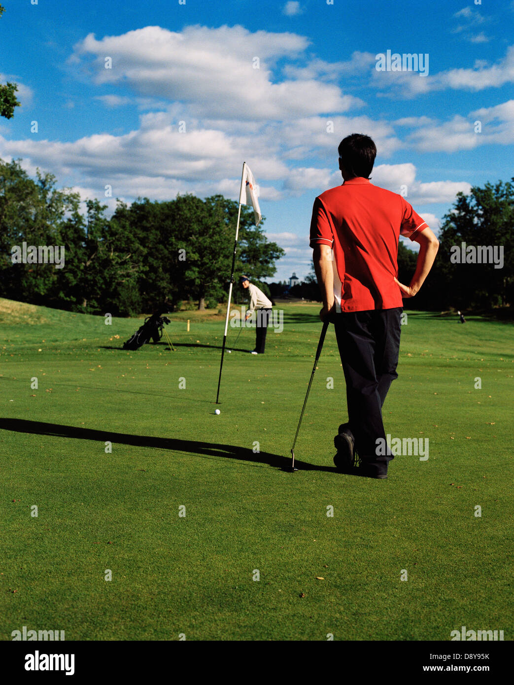 Two friends playing golf, Sweden Stock Photo - Alamy