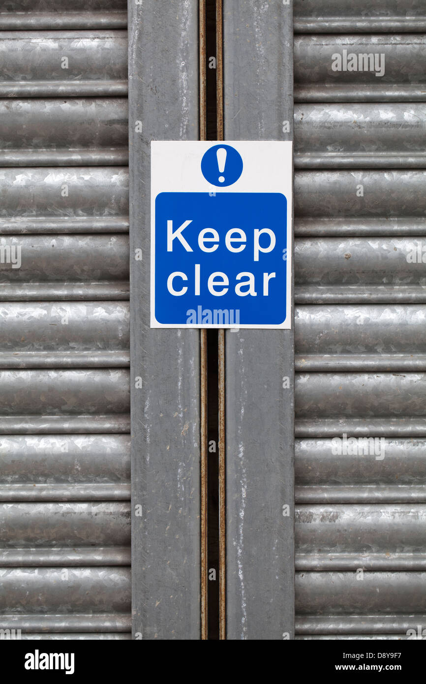 Keep Out Sign on Industrial Shutters Stock Photo - Alamy