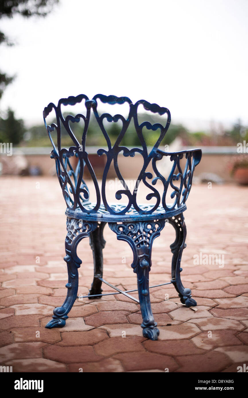 blue metal chair on patio Stock Photo - Alamy
