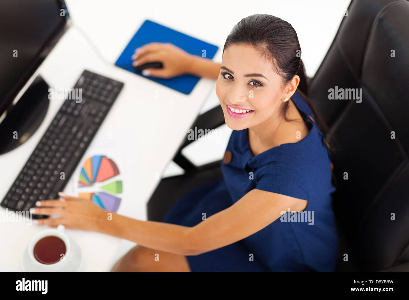 overhead view of female corporate worker working by her desk Stock ...
