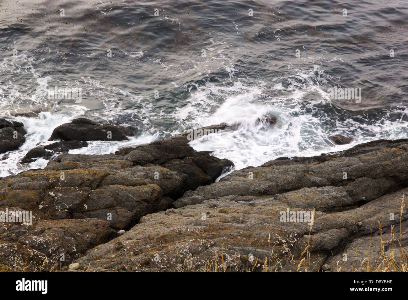 Rocky Coast with waves hitting the shore Stock Photo - Alamy