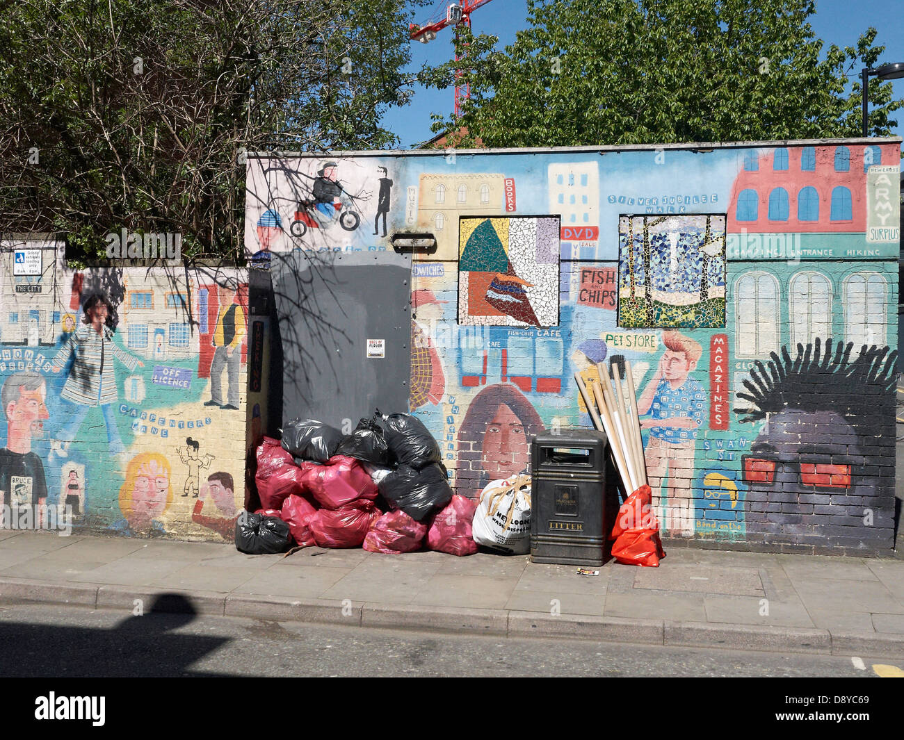 Rubbish with mural in Northern Quarter Manchester UK Stock Photo - Alamy