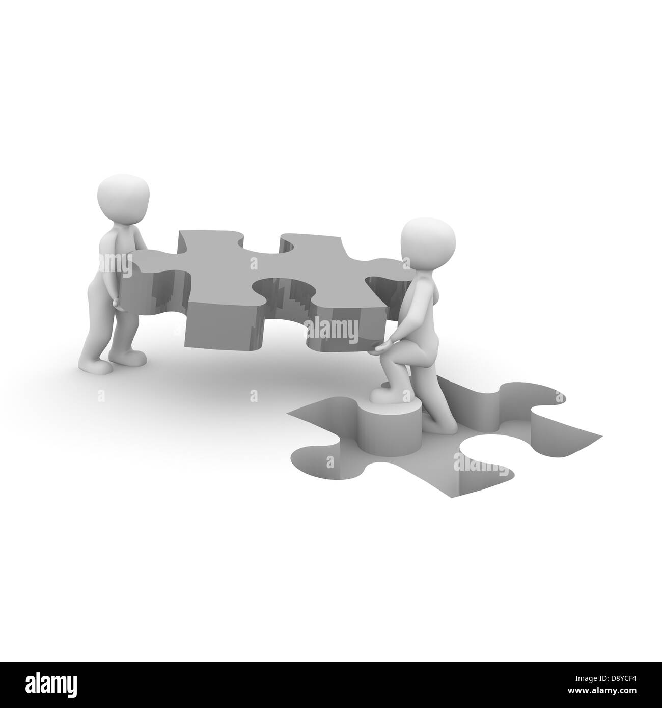 Two characters employ a gray, big puzzle piece Stock Photo - Alamy