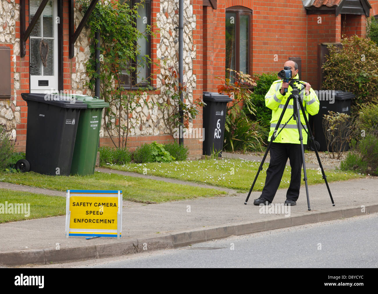 Man using speed camera to monitor traffic speeds Stock Photo - Alamy