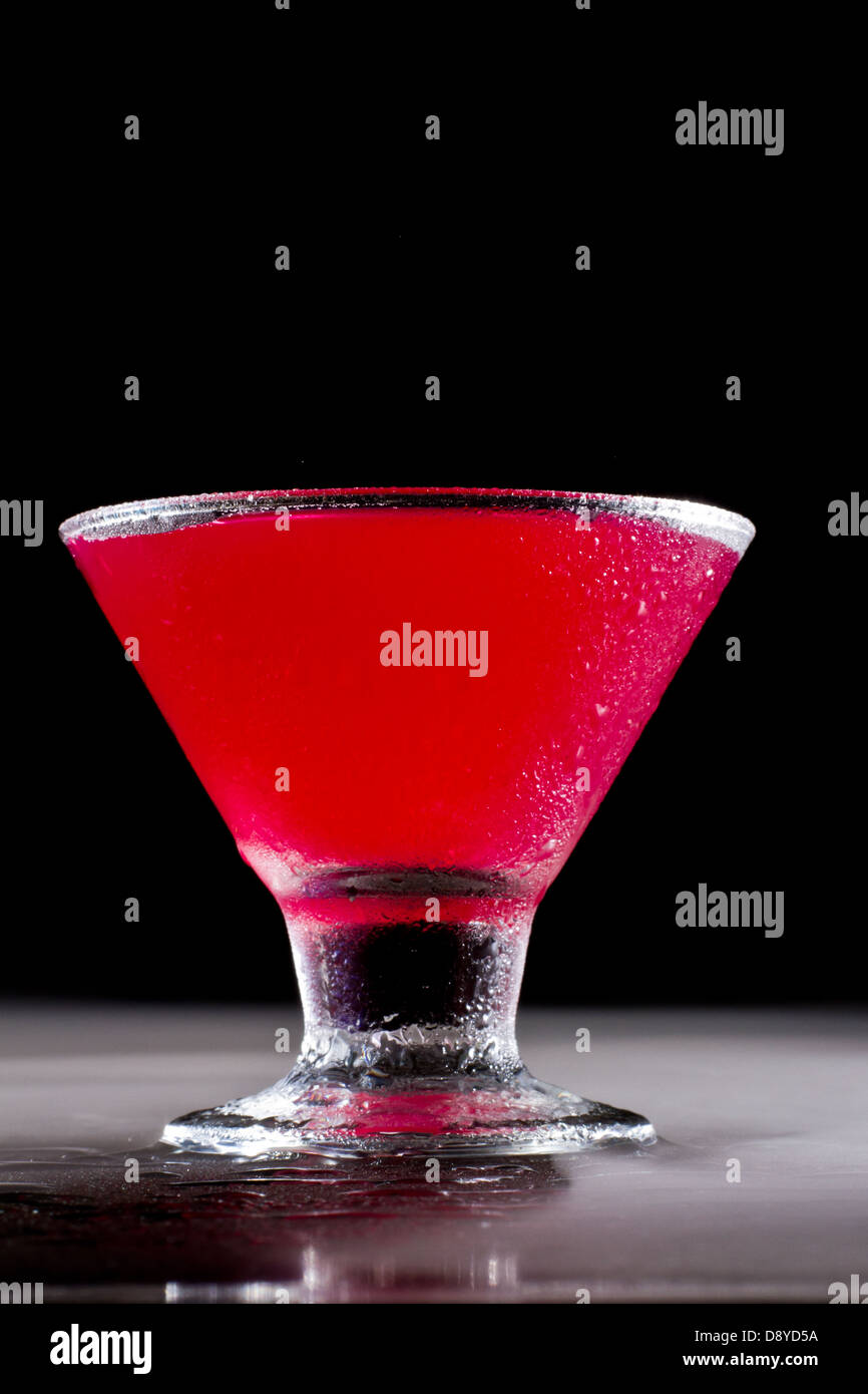 small bright red cocktail on a dark foggy dramatic bar Stock Photo - Alamy