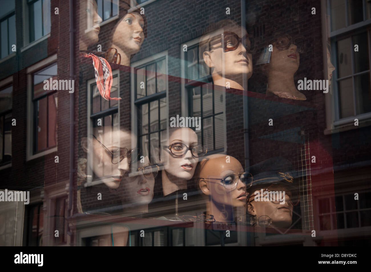 Mannequin heads on display in a junk shop window in Amsterdam Stock ...