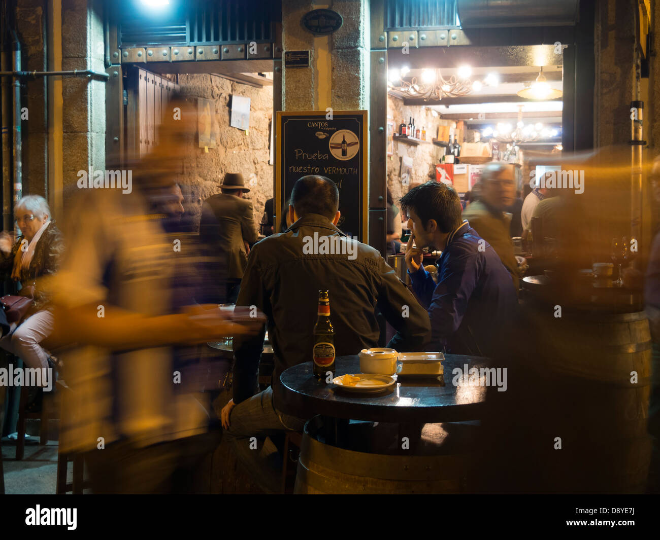 Young people drinking outside bar Stock Photo - Alamy
