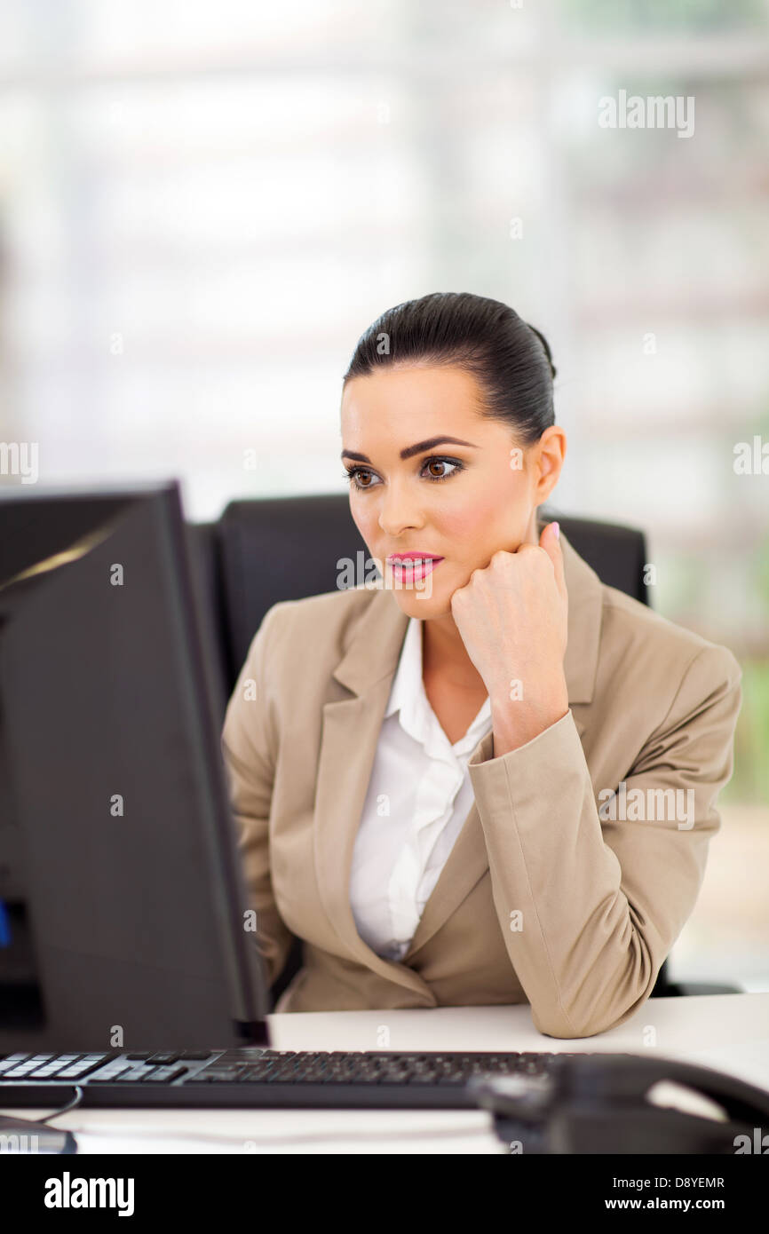 Pretty business woman working at office desk Stock Photo - Alamy