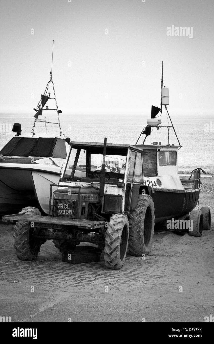 Tractor and fishing boat Stock Photo - Alamy