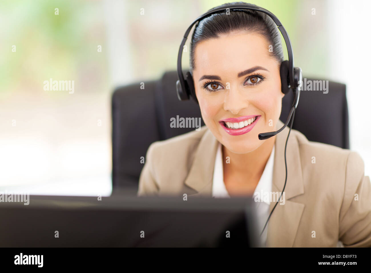 Portrait of friendly call center consultant with headphones Stock Photo ...