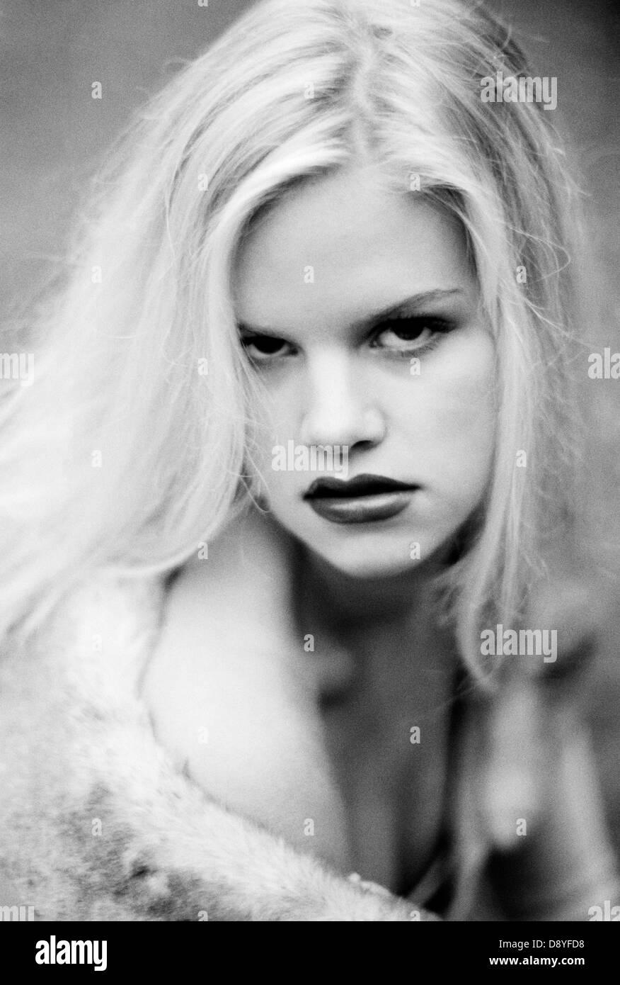 A young, blond woman with a defiant look on her face Stock Photo - Alamy