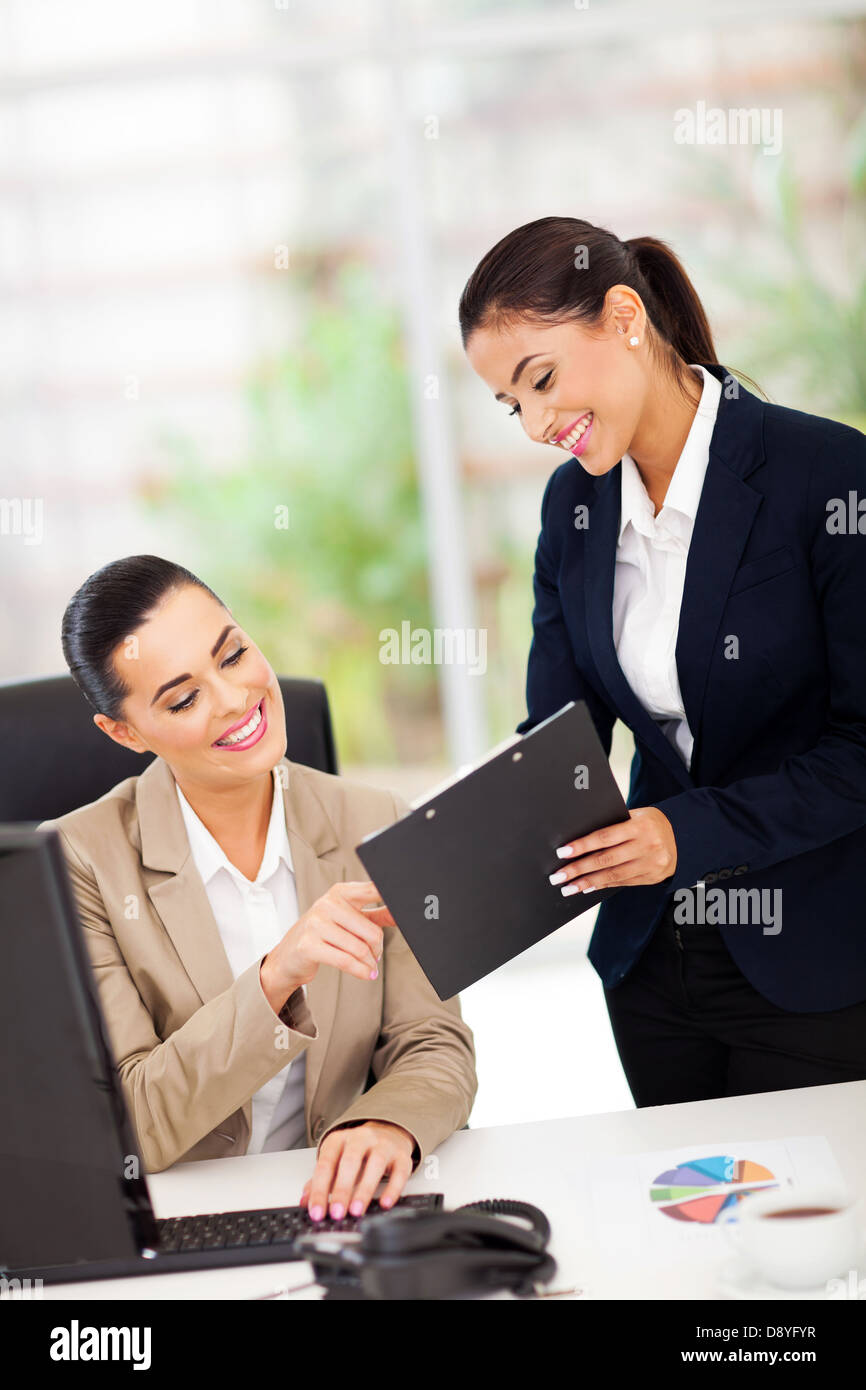 cheerful business women working in office Stock Photo - Alamy