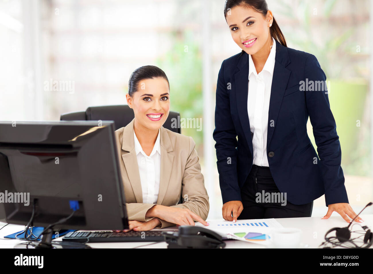 portrait of beautiful smiling business women in office Stock Photo - Alamy