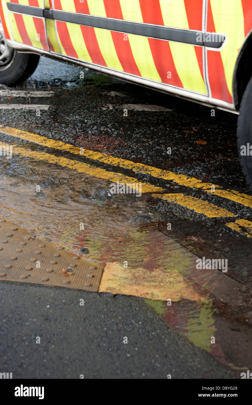 Burst water main flooded road waste Stock Photo - Alamy