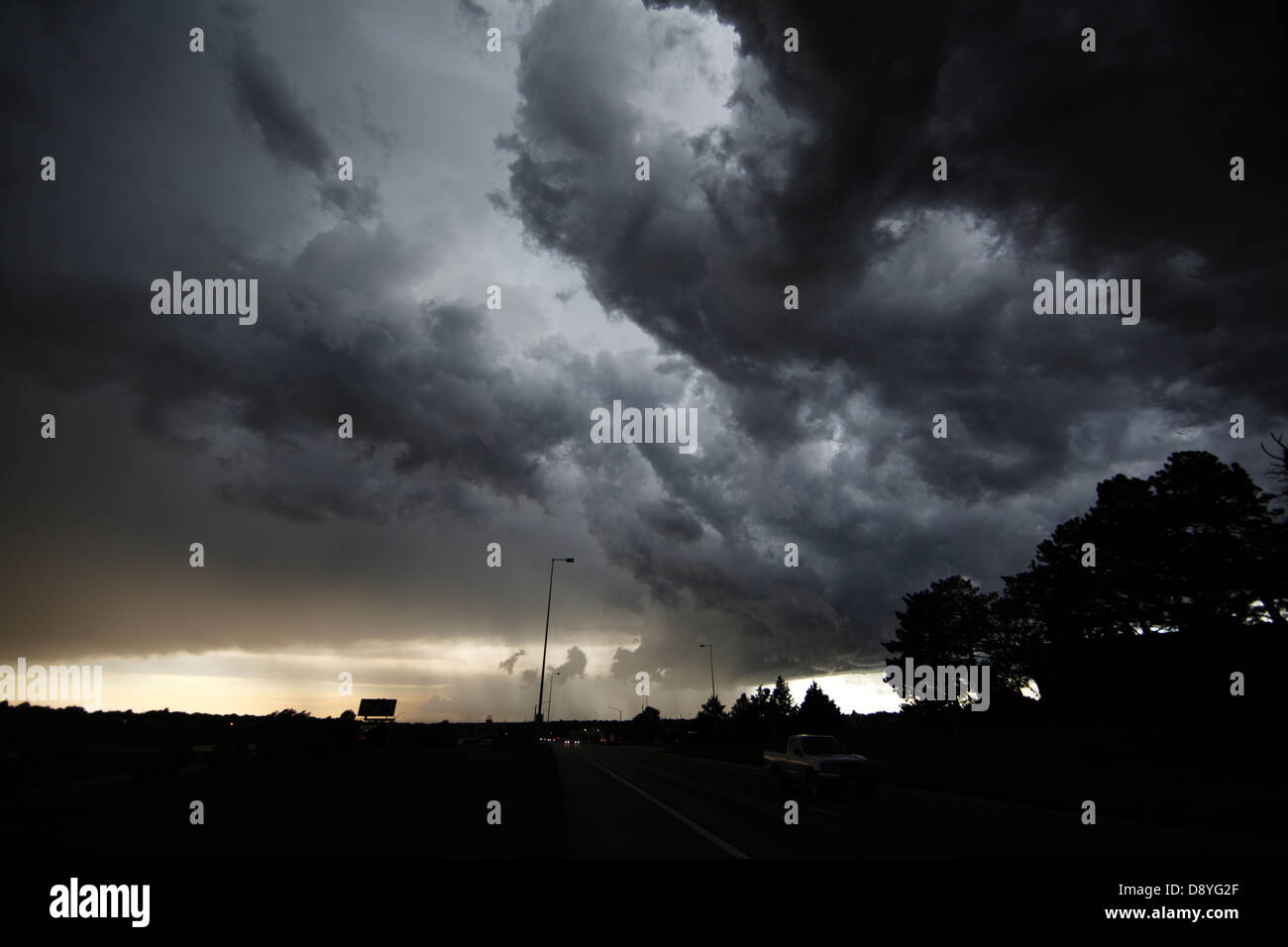 Powerful small thunderstorm over a highway Stock Photo - Alamy