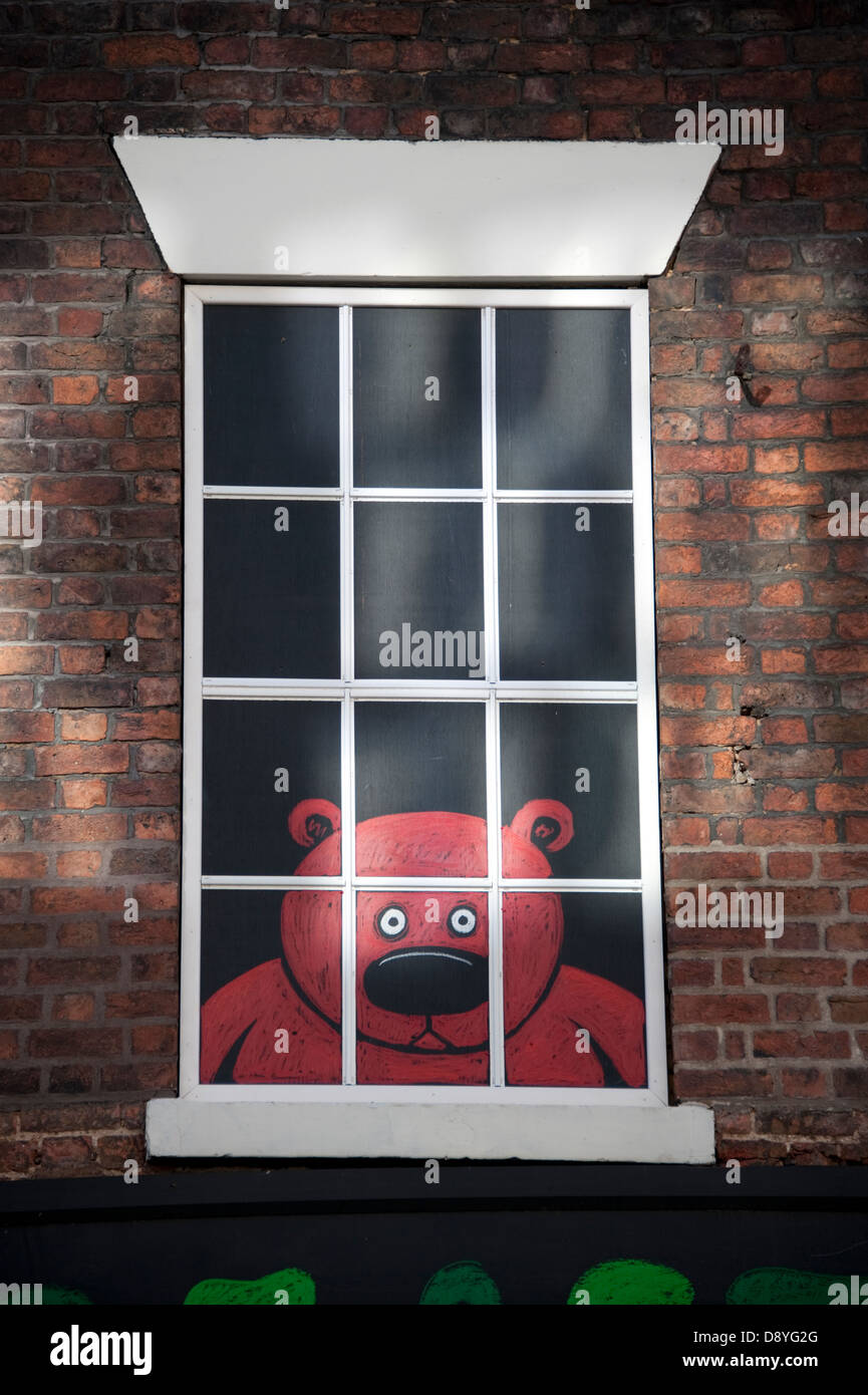 Red teddy bear looking through window smiling Stock Photo - Alamy