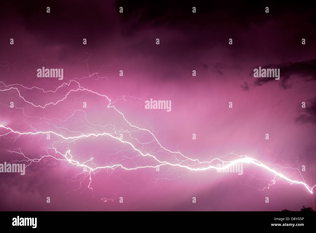 Lightning striking a communications tower in lower corner Stock Photo ...