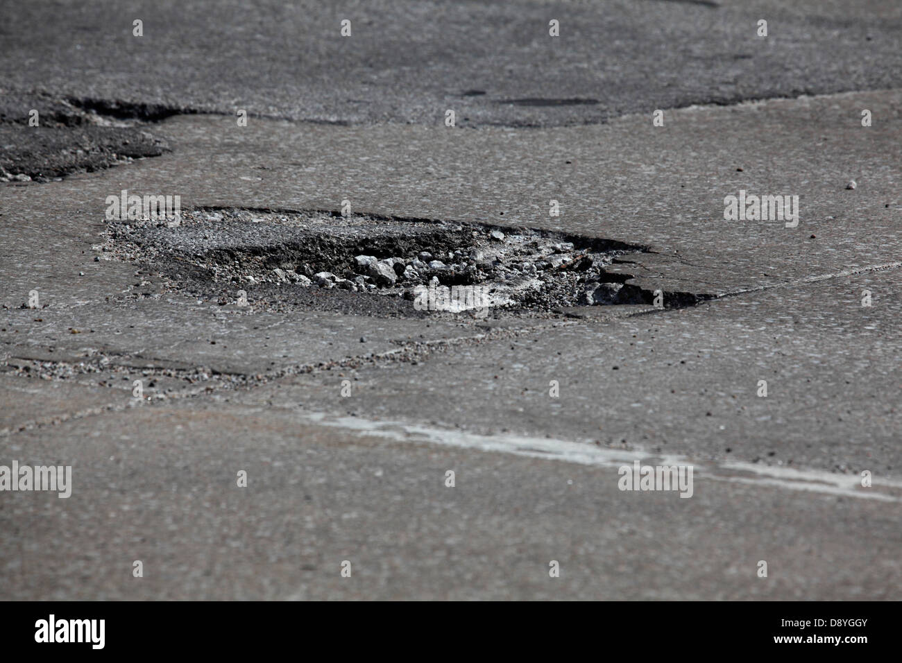 Pothole in road Stock Photo - Alamy