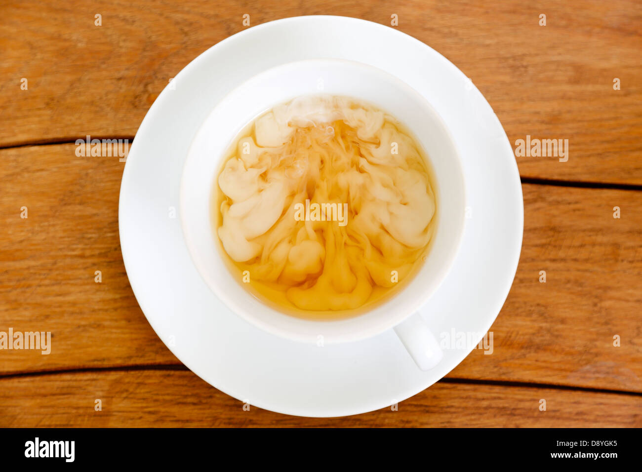 Cup of tea with tea pot and milk Stock Photo - Alamy