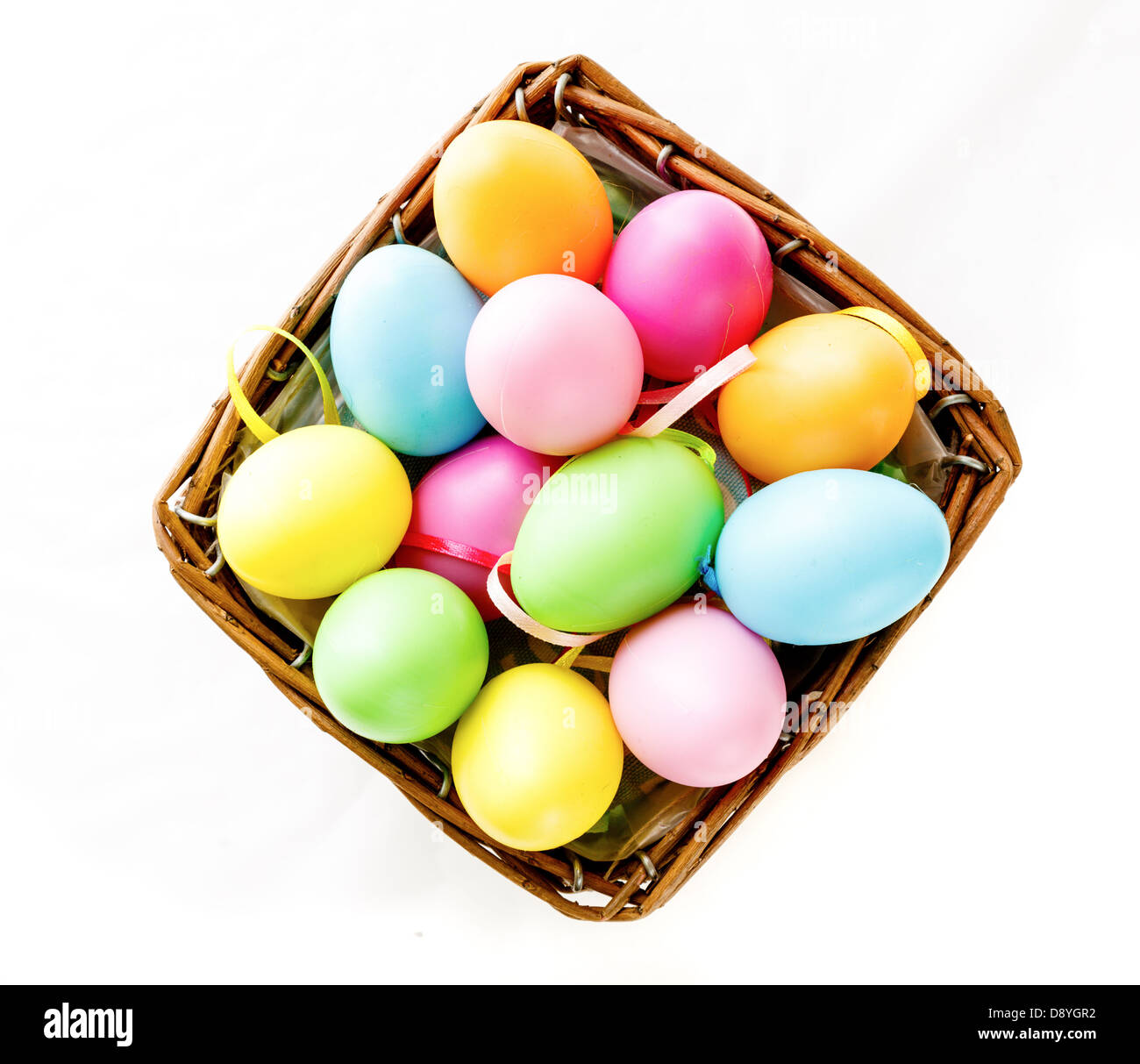 Colorful easter eggs in wicker basket Stock Photo - Alamy