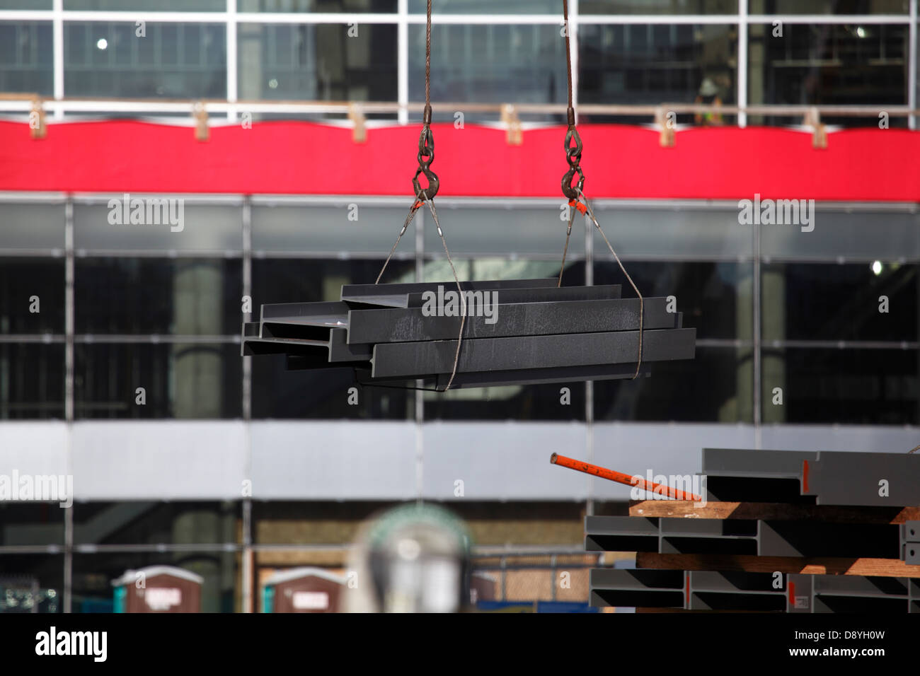 Steel beams being moved Stock Photo - Alamy
