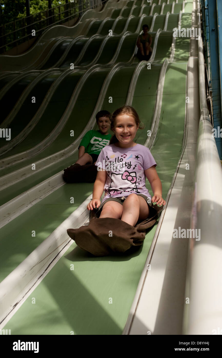 Children having fun on slide FULLY MODEL RELEASED Stock Photo - Alamy