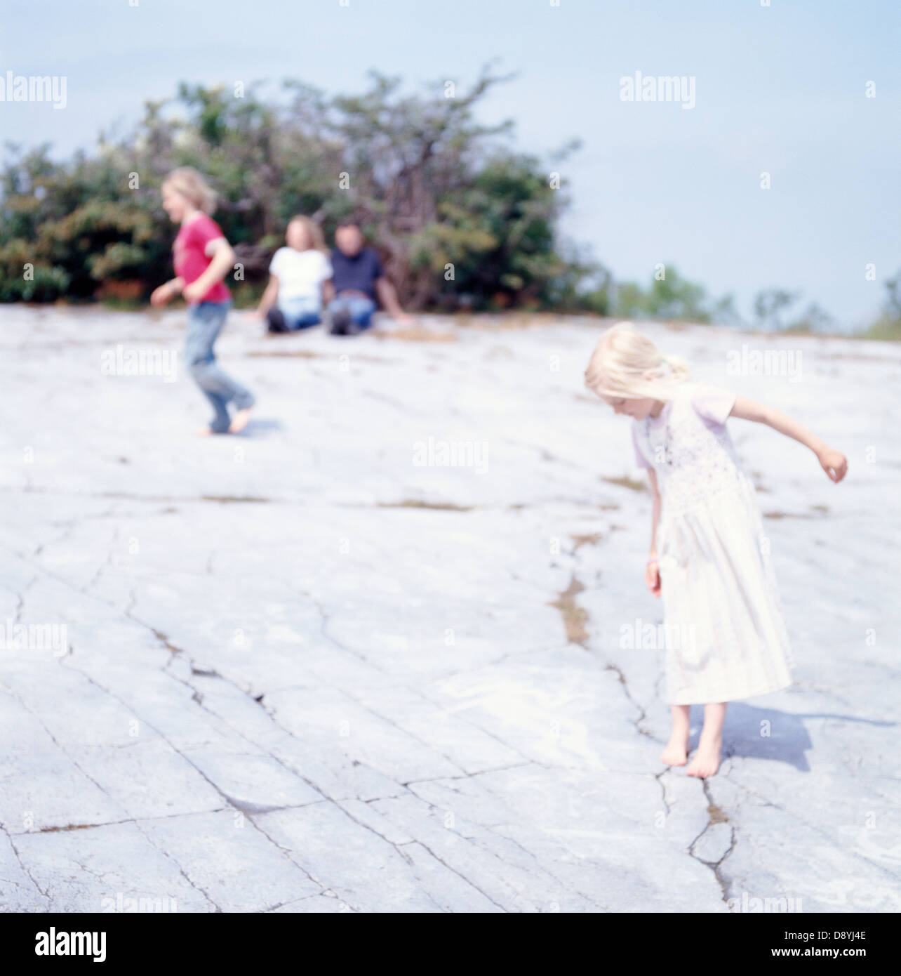 Two children playing on rocks hi-res stock photography and images - Alamy