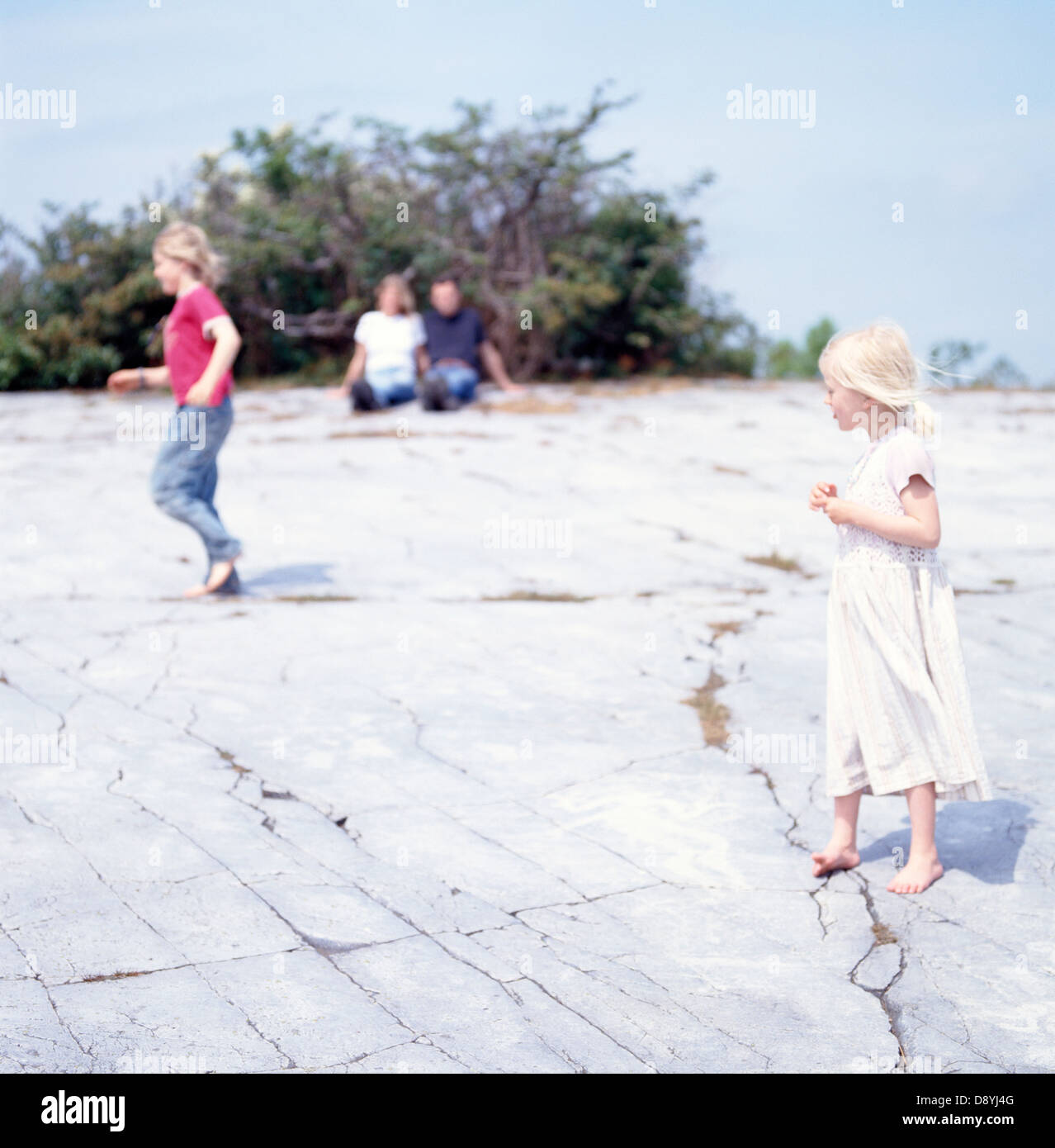 Two children playing on rocks hi-res stock photography and images - Alamy