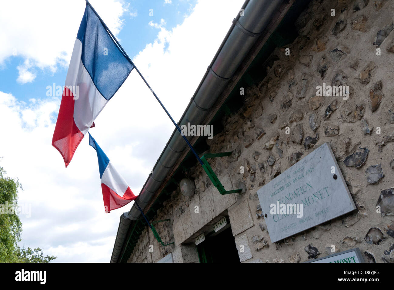 Two France flags on the front exterior of Claude Monet's house in ...