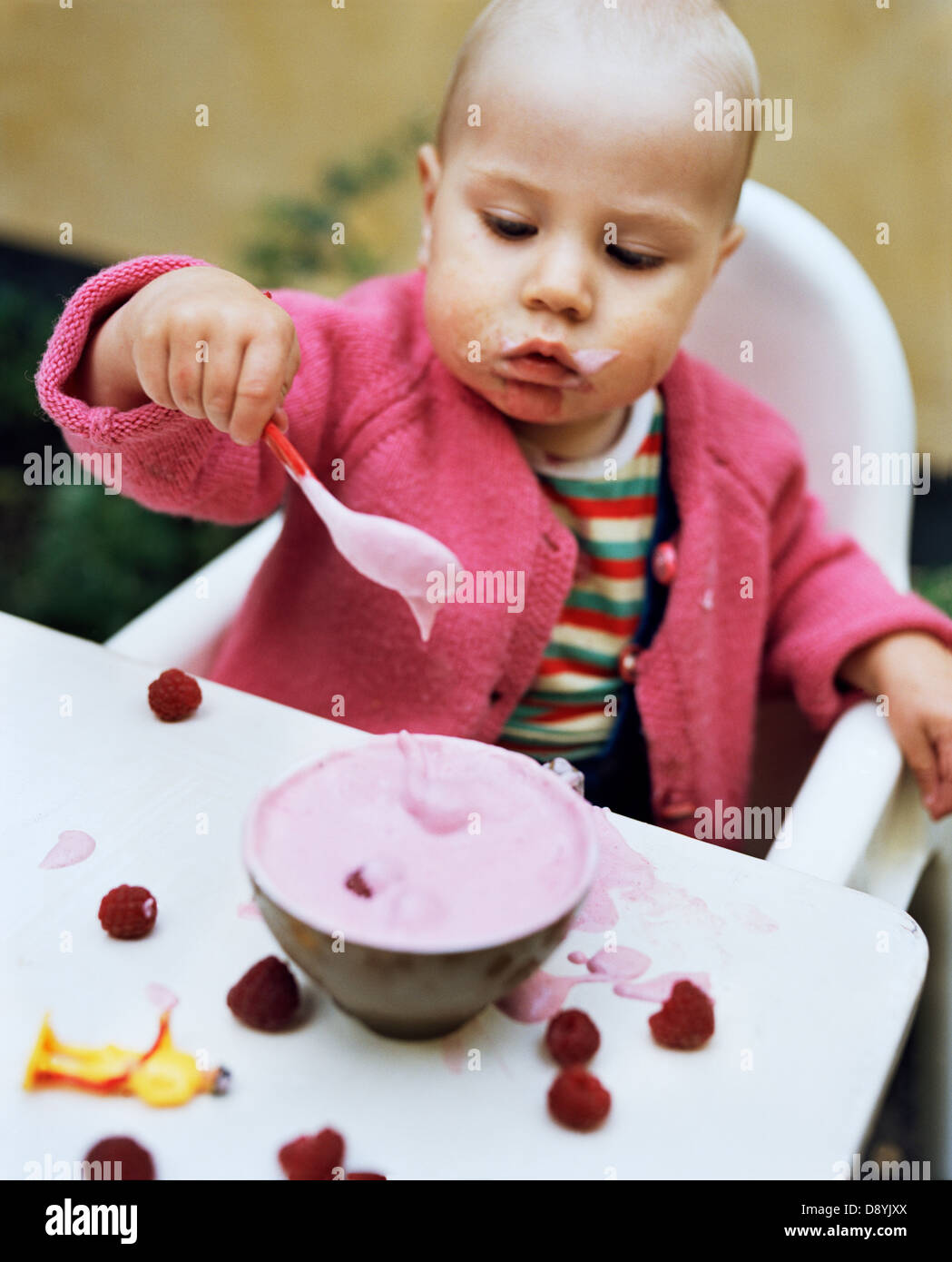 A child eating raspberry and yoghurt, Sweden Stock Photo - Alamy