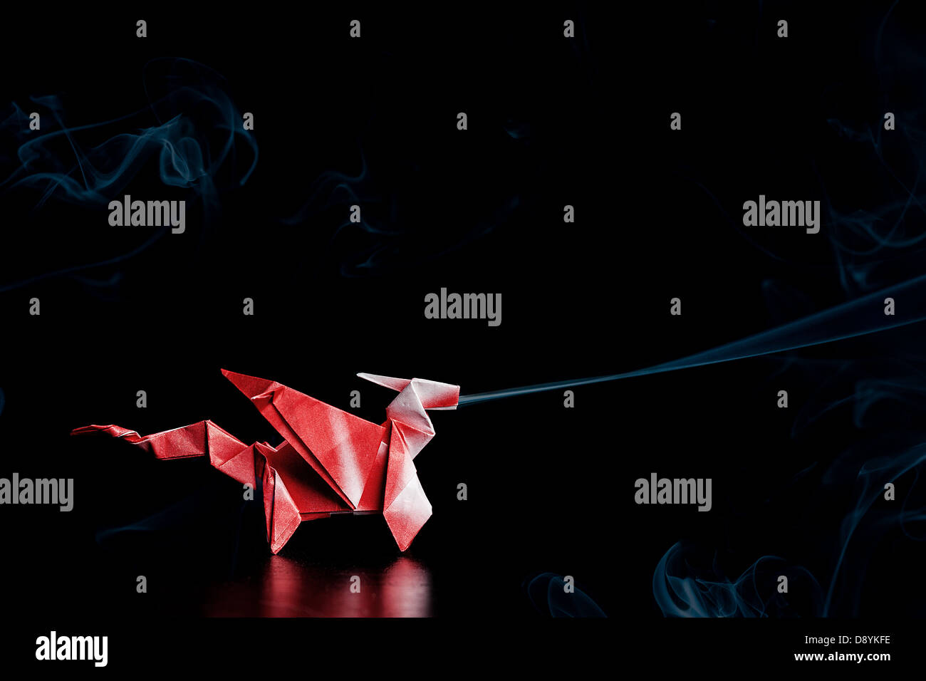 Red and white origami dragon billows smoke from its nose in this ...