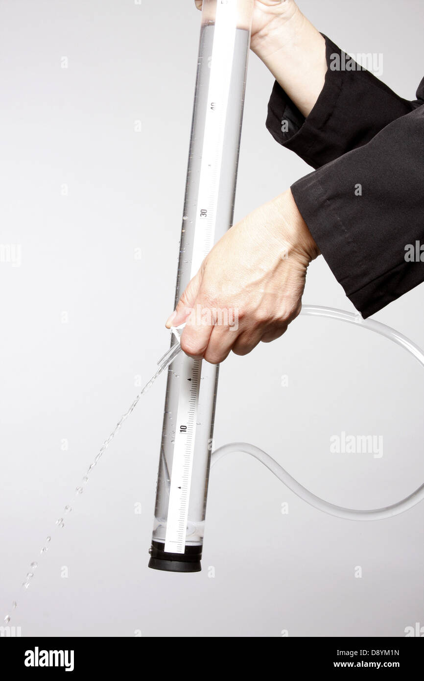 The draining of a turbidity tube to find out the clarity of the water ...