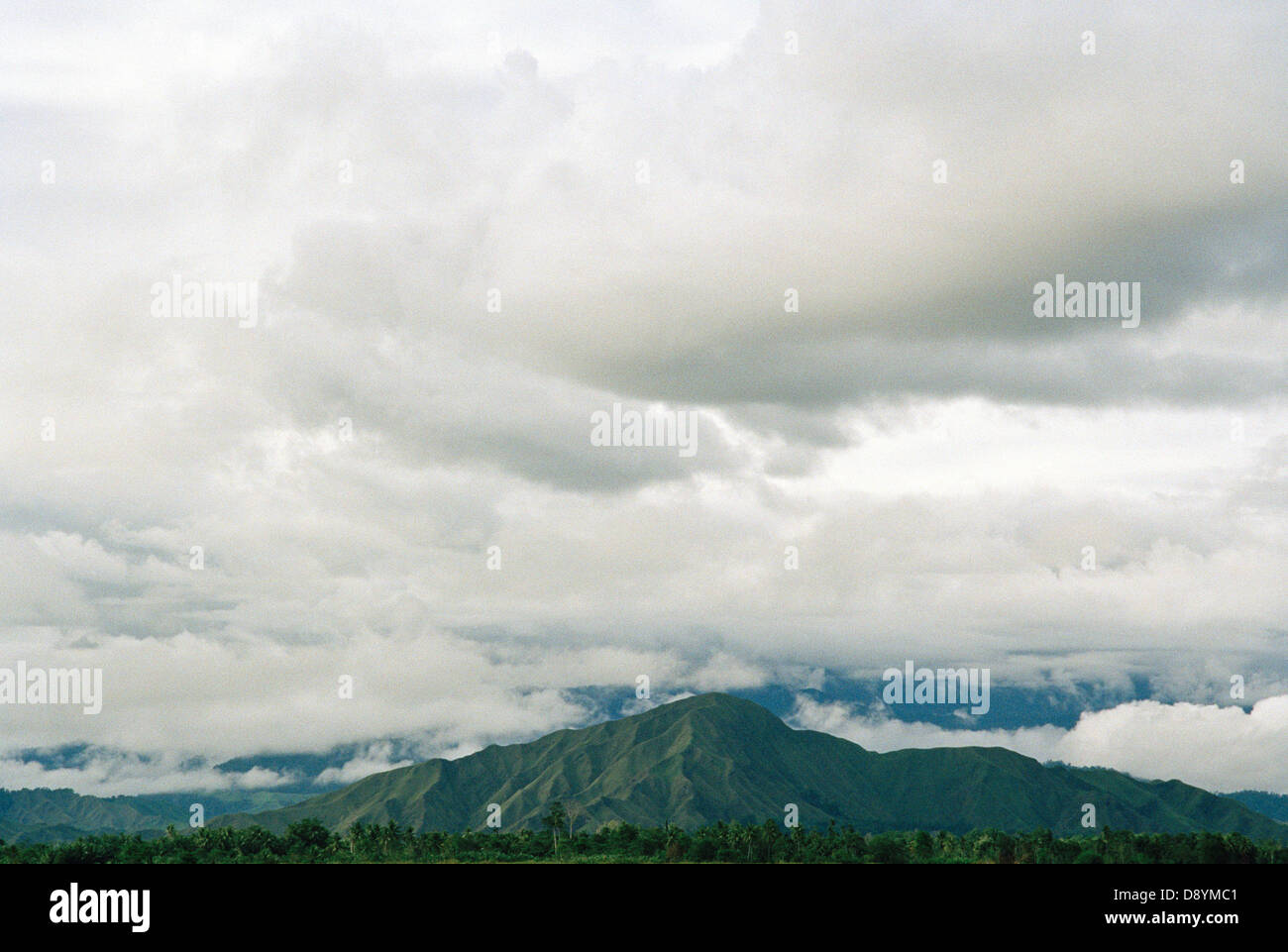 A mountain scenery under a cloudy sky, Papua New Guinea Stock Photo - Alamy