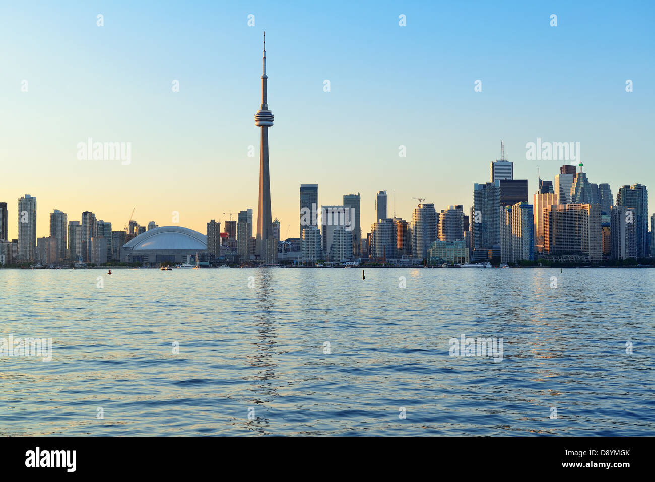 Toronto skyline in the day over lake with urban architecture and blue ...